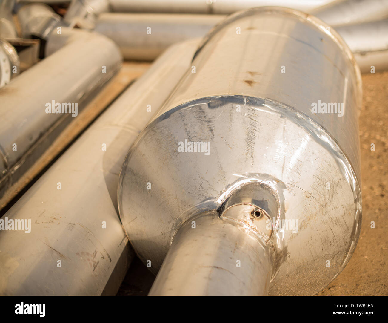 Big industrial metal reservoir and tubes. Outdoor warehouse of metal ...