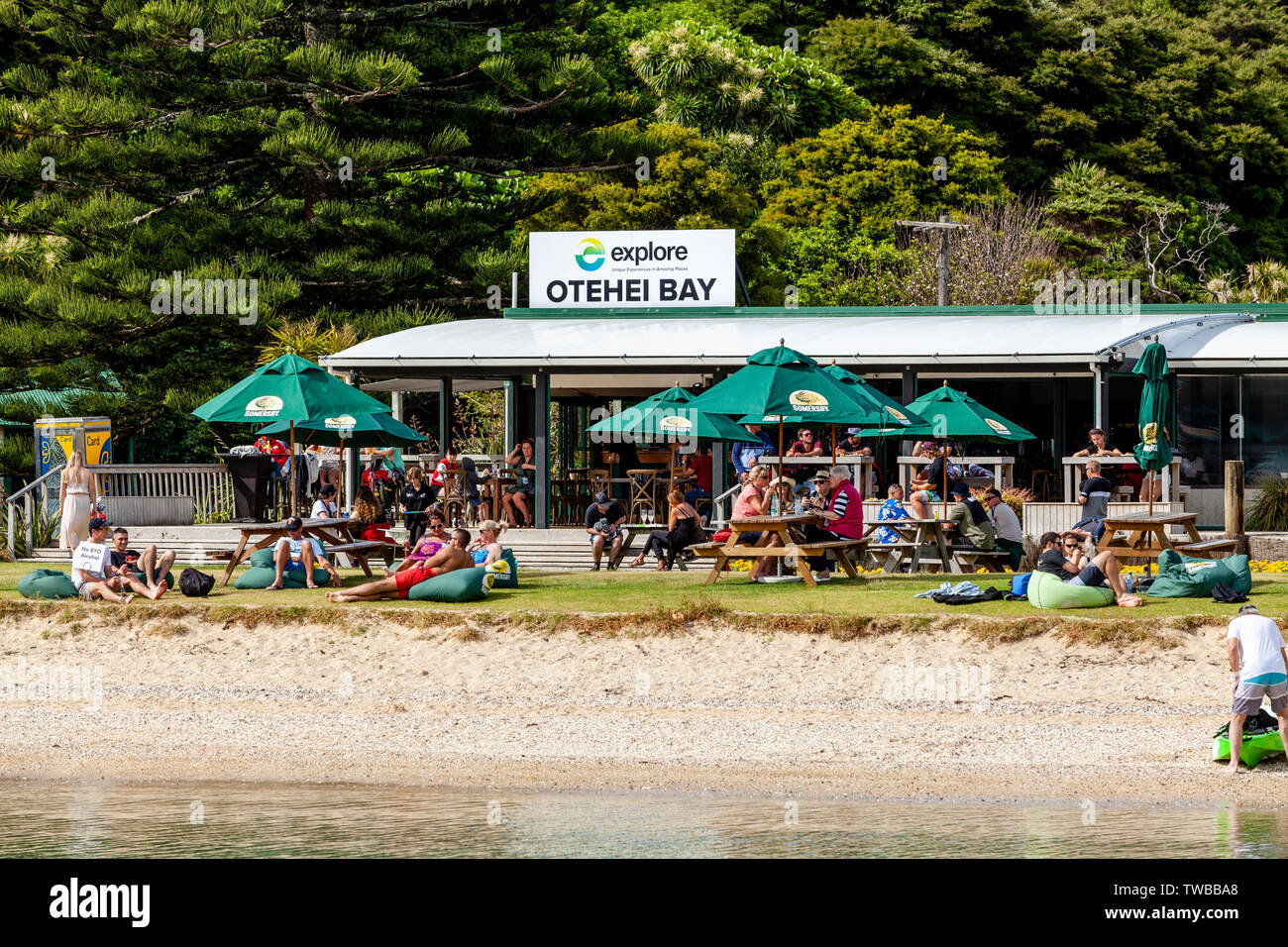 People Relaxing On Otehei Bay, Urupukapuka Island, The Bay Of Islands ...