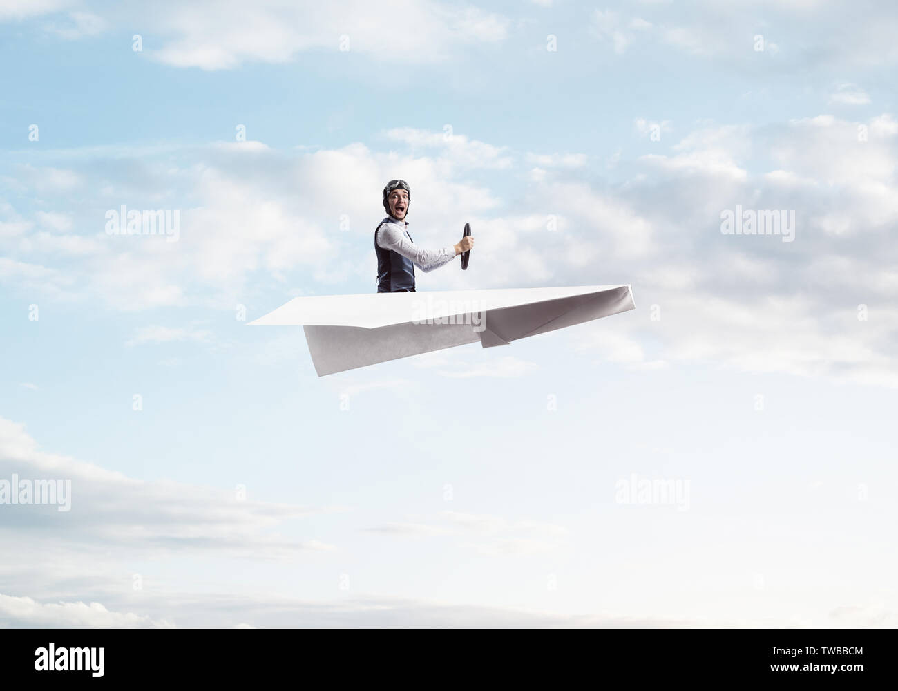 Aviator having fun in aircraft. Pilot in leather helmet and goggles ...