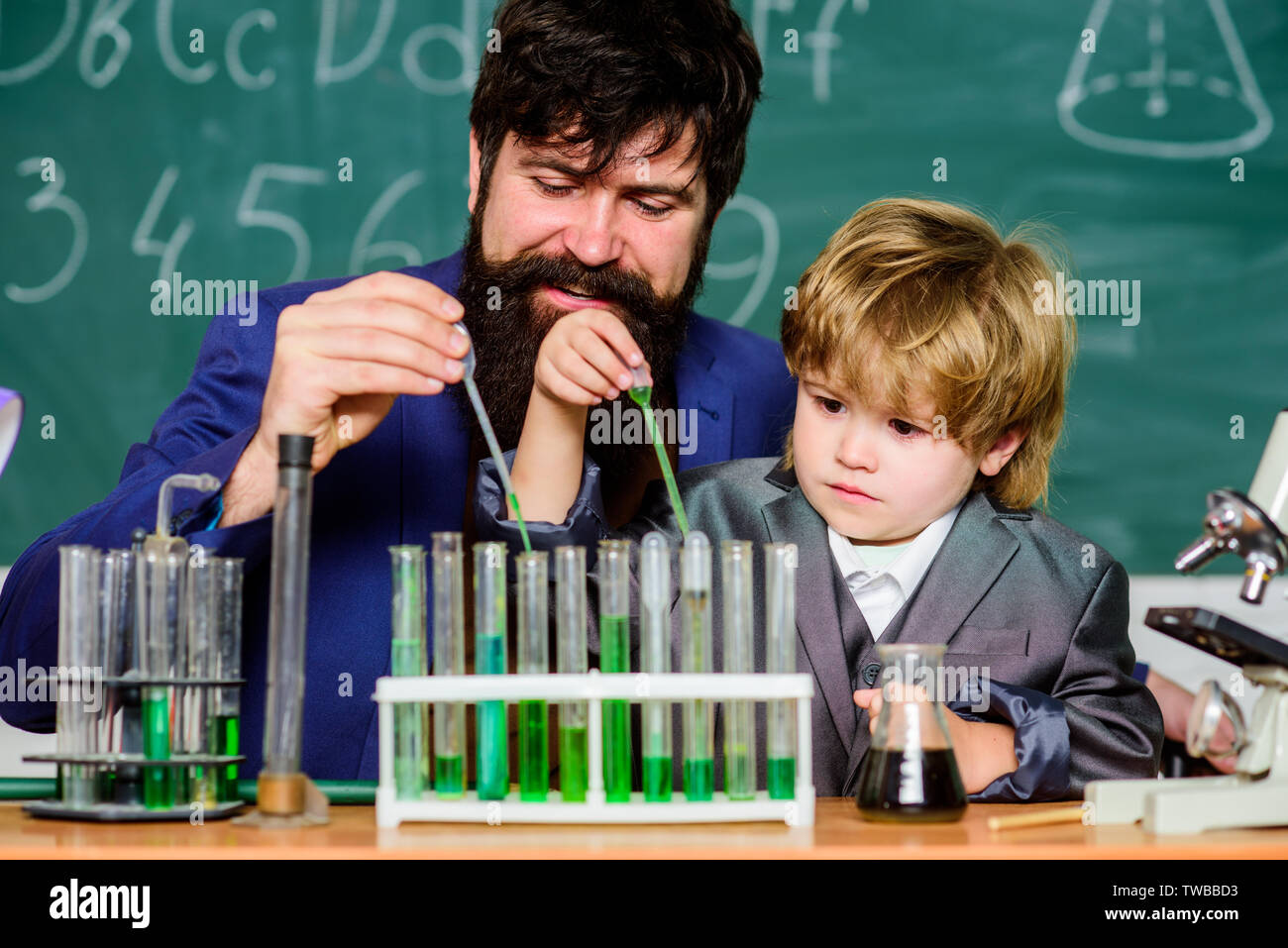teacher man with little boy. father and son at school. Little kid ...