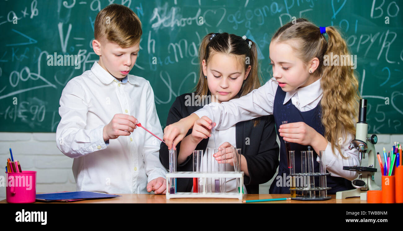 students doing biology experiments with microscope in lab. biology ...
