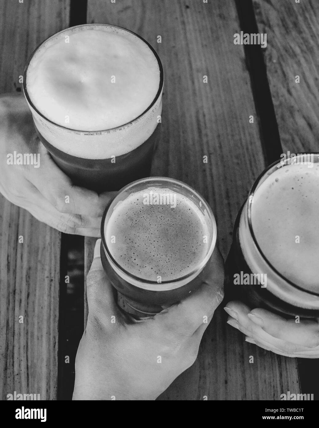 Beers cheers Black and White Stock Photos & Images - Alamy