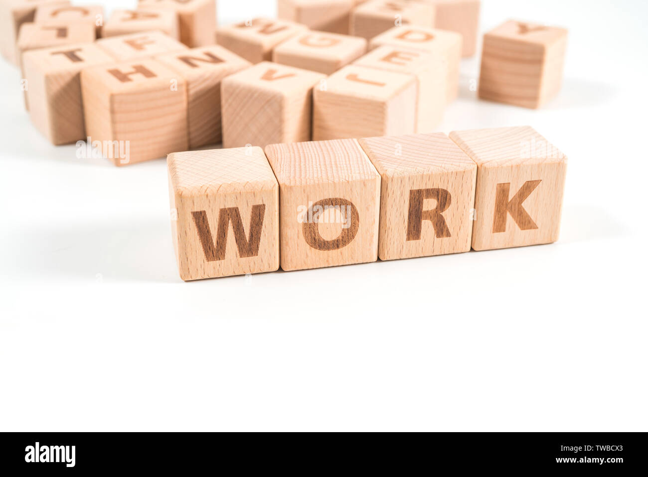 Work wooden blocks of business concept isolated on white background ...