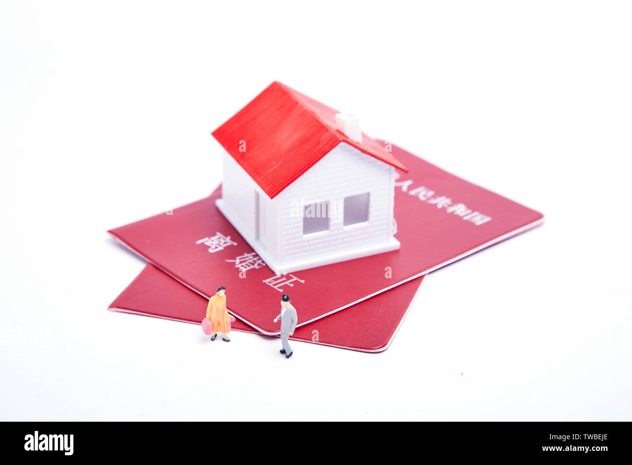 Divorce certificates and house models Stock Photo - Alamy