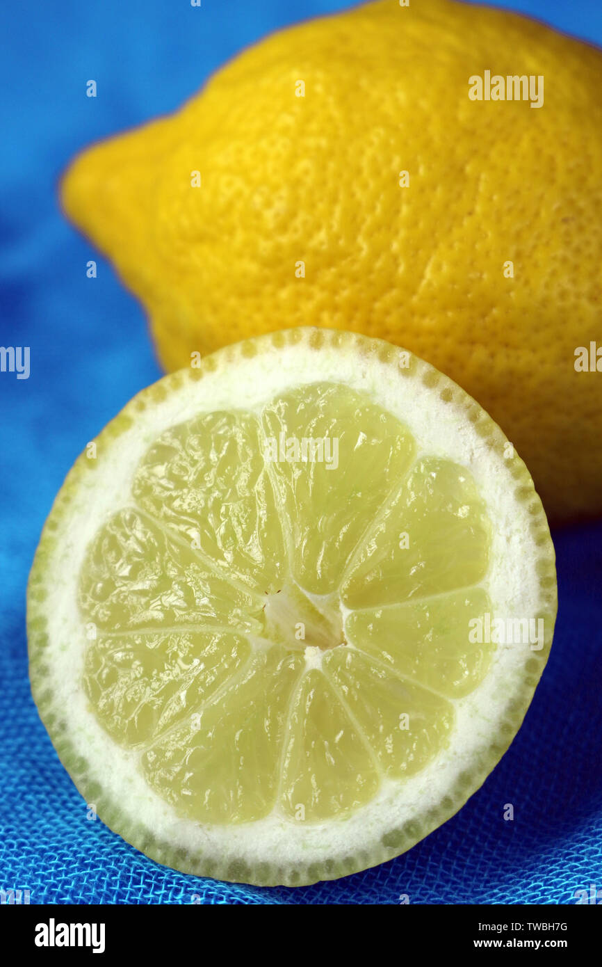 One Whole and Half a Sliced Lemon Stock Photo - Alamy