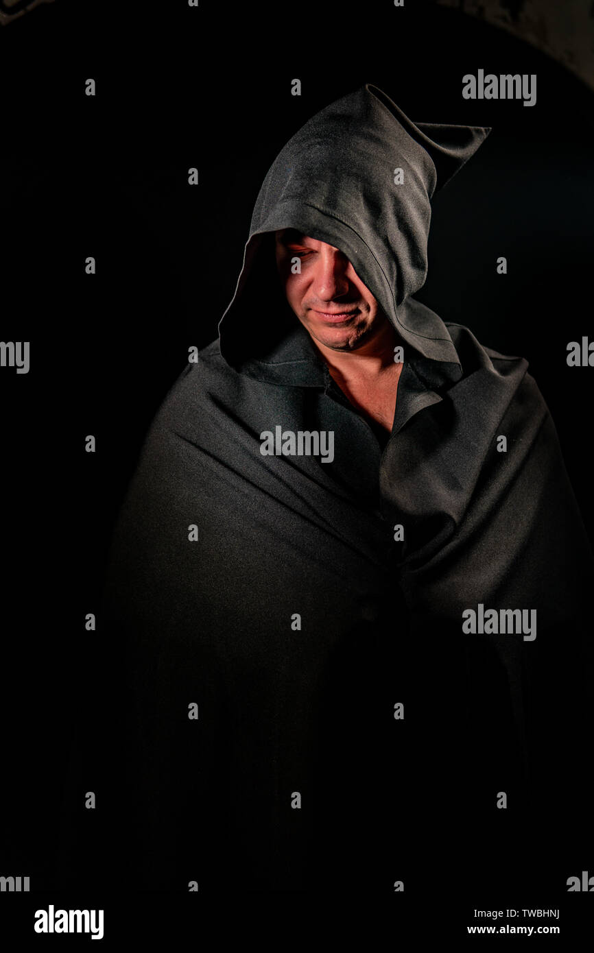 Portrait of a courageous warrior wanderer in a black cloak. Historical ...
