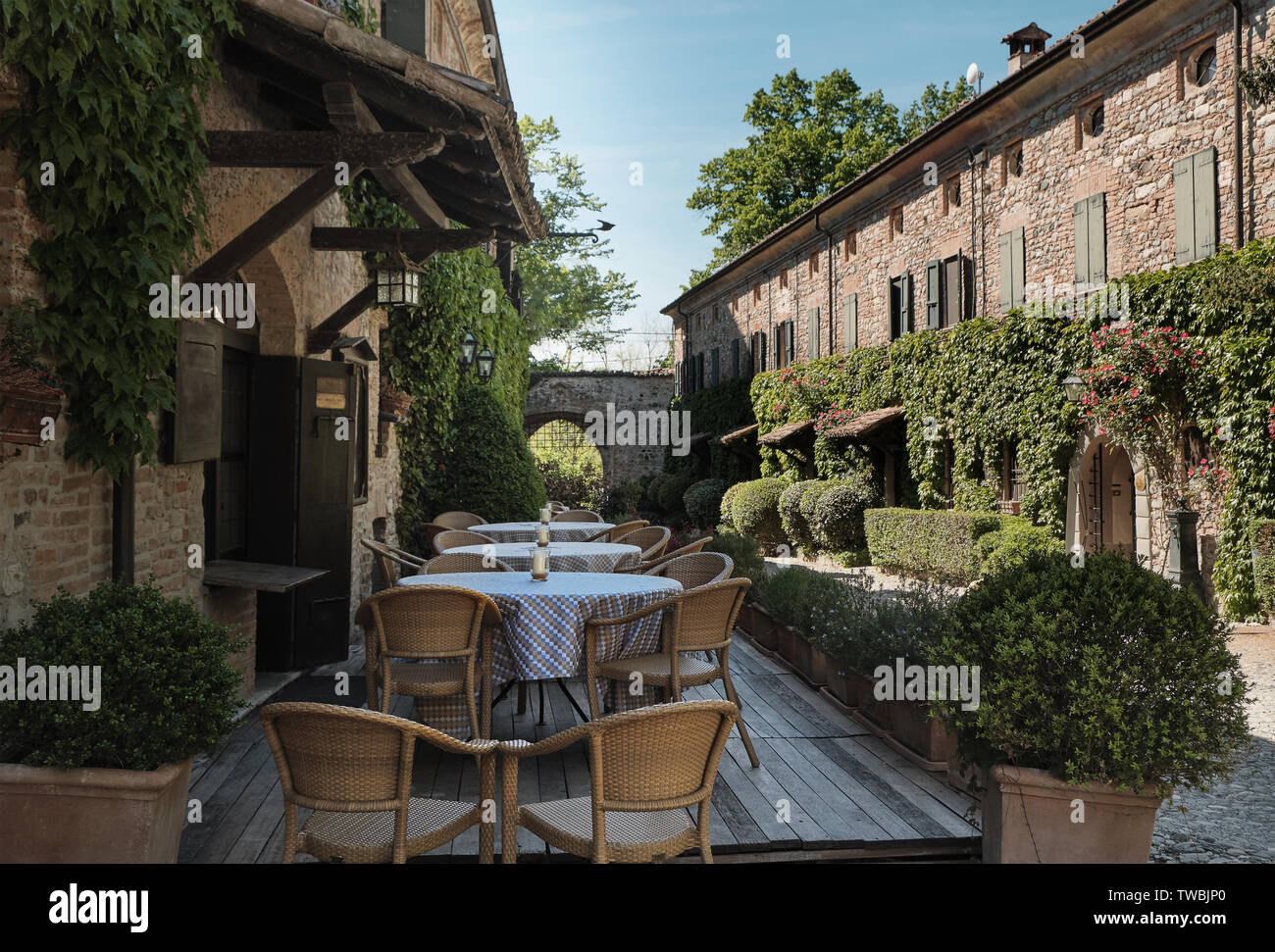April 2019 PIACENZA ITALY - table and chairs of restaurants in front of ...