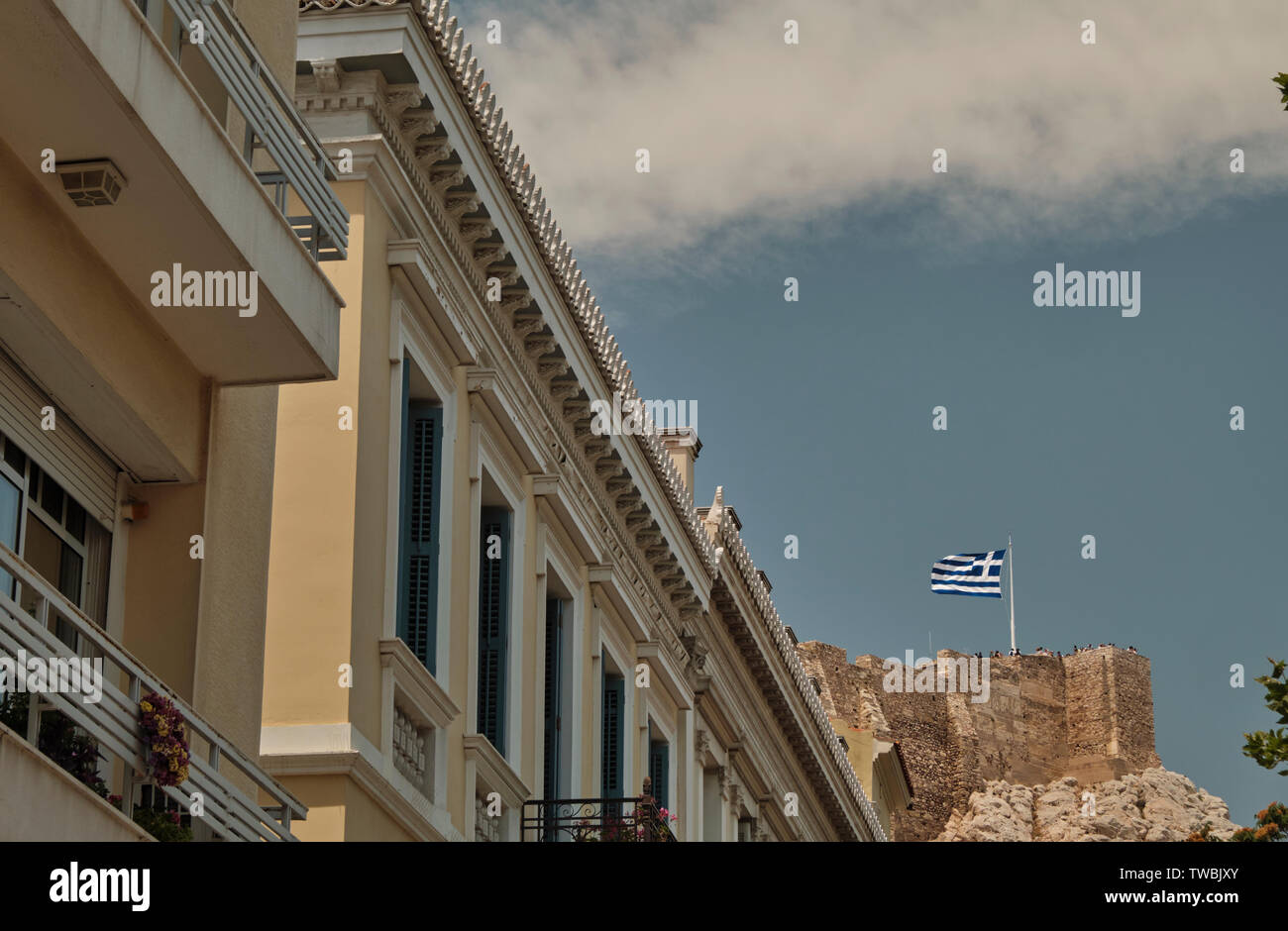 typical old facade in athens with the Acropolis in a sunny day in the ...