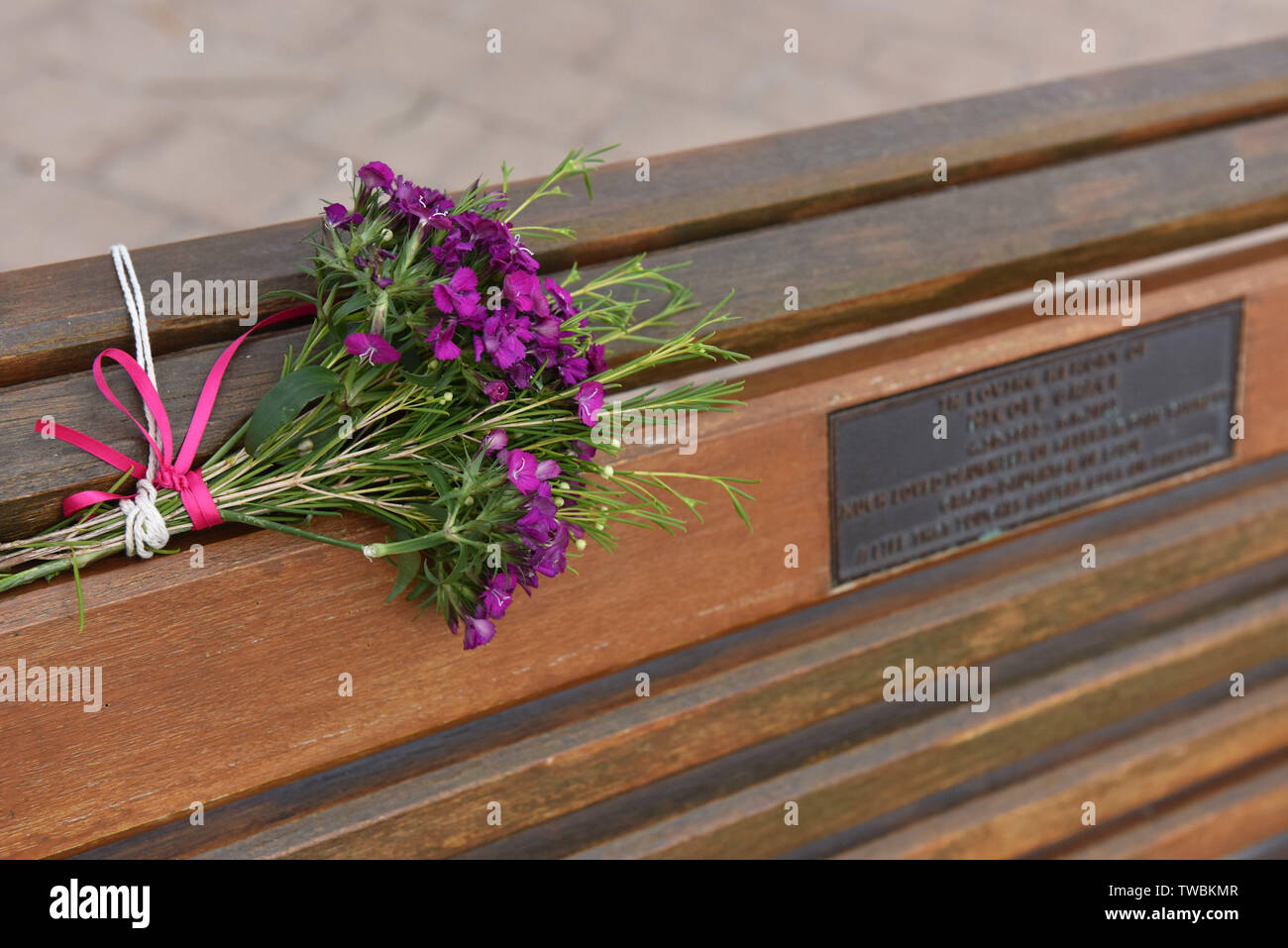 Flowers on a bench Stock Photo - Alamy