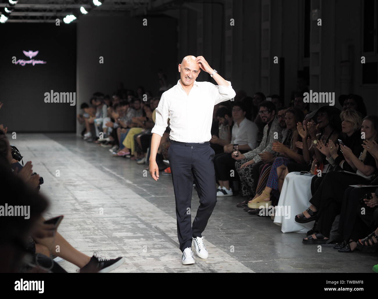 MILAN, ITALY - June 17: Miguel Vieira on catwalk after fashion show ...
