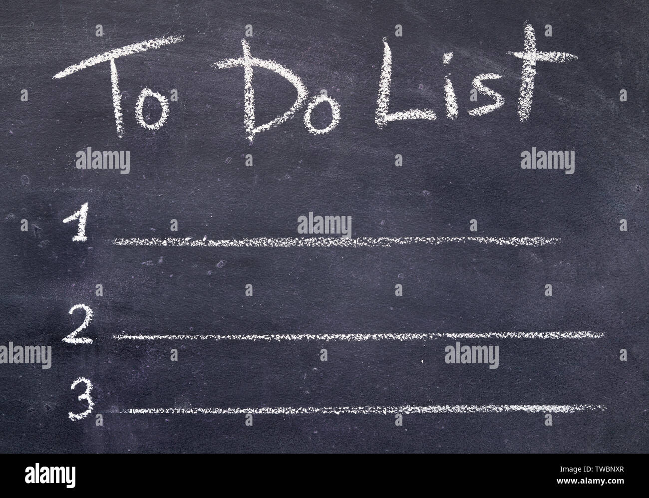 Planning concept. Handwriting to do list with chalk on black board ...