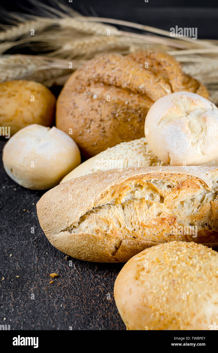 assortment of different types of bread, loaf, baguettes, loaves, rolls ...