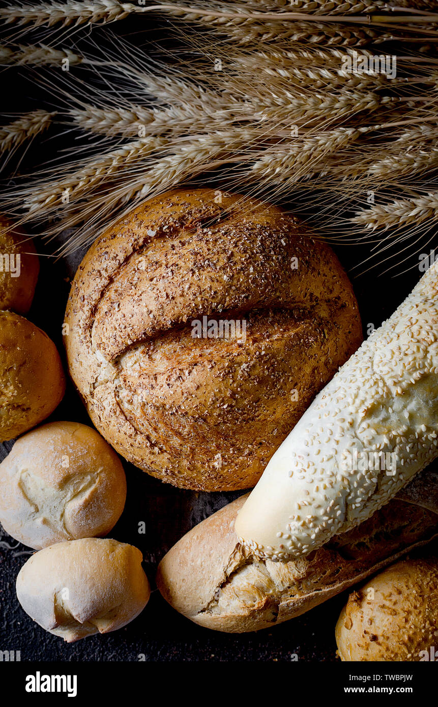 assortment of different types of bread, loaf, baguettes, loaves, rolls ...