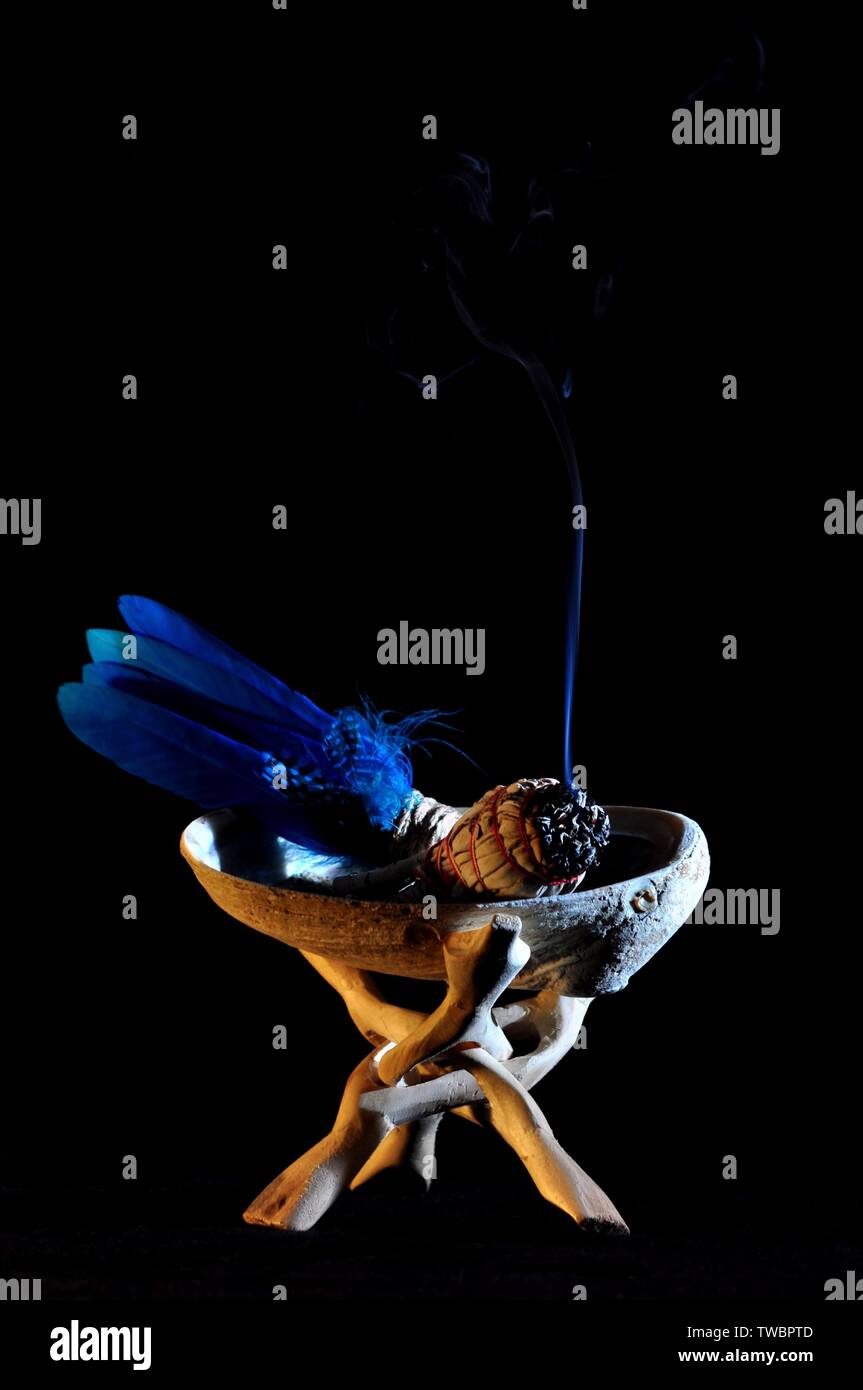 A smudge stick with burning smoke in abalone shell (portrait Stock ...
