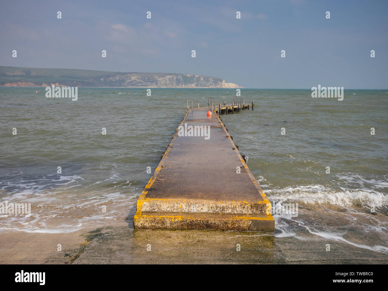 Concrete jetty looking towards Old Harry Rocks in Swanage, Dorset, UK ...
