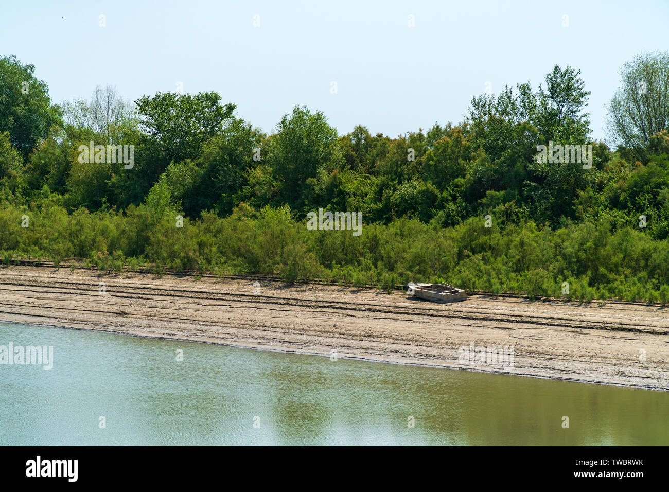 Coast of a wide flat river Stock Photo - Alamy