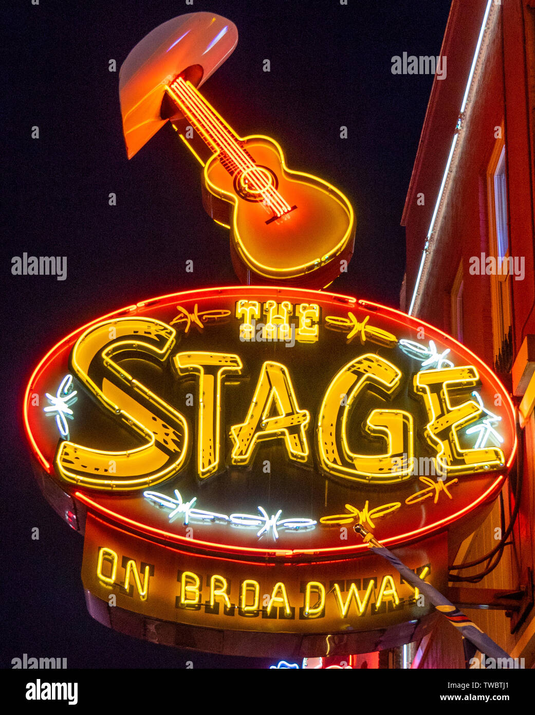 Restaurant bar and concert venue The Stage on Broadway neon sign lit up ...