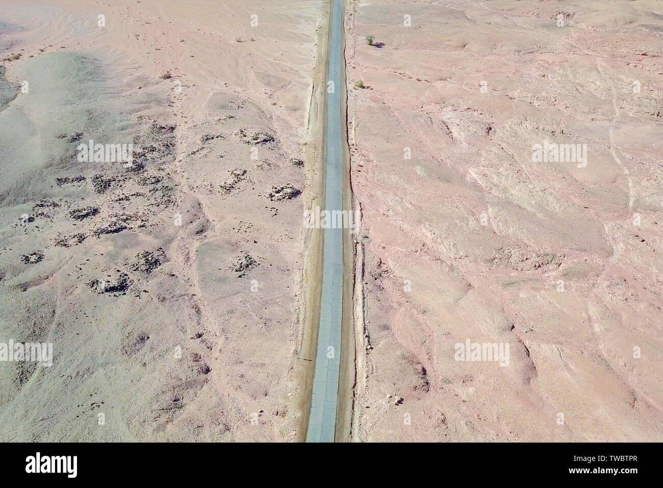Old Desert road with cracked asphalt, Top down aerial image Stock Photo ...