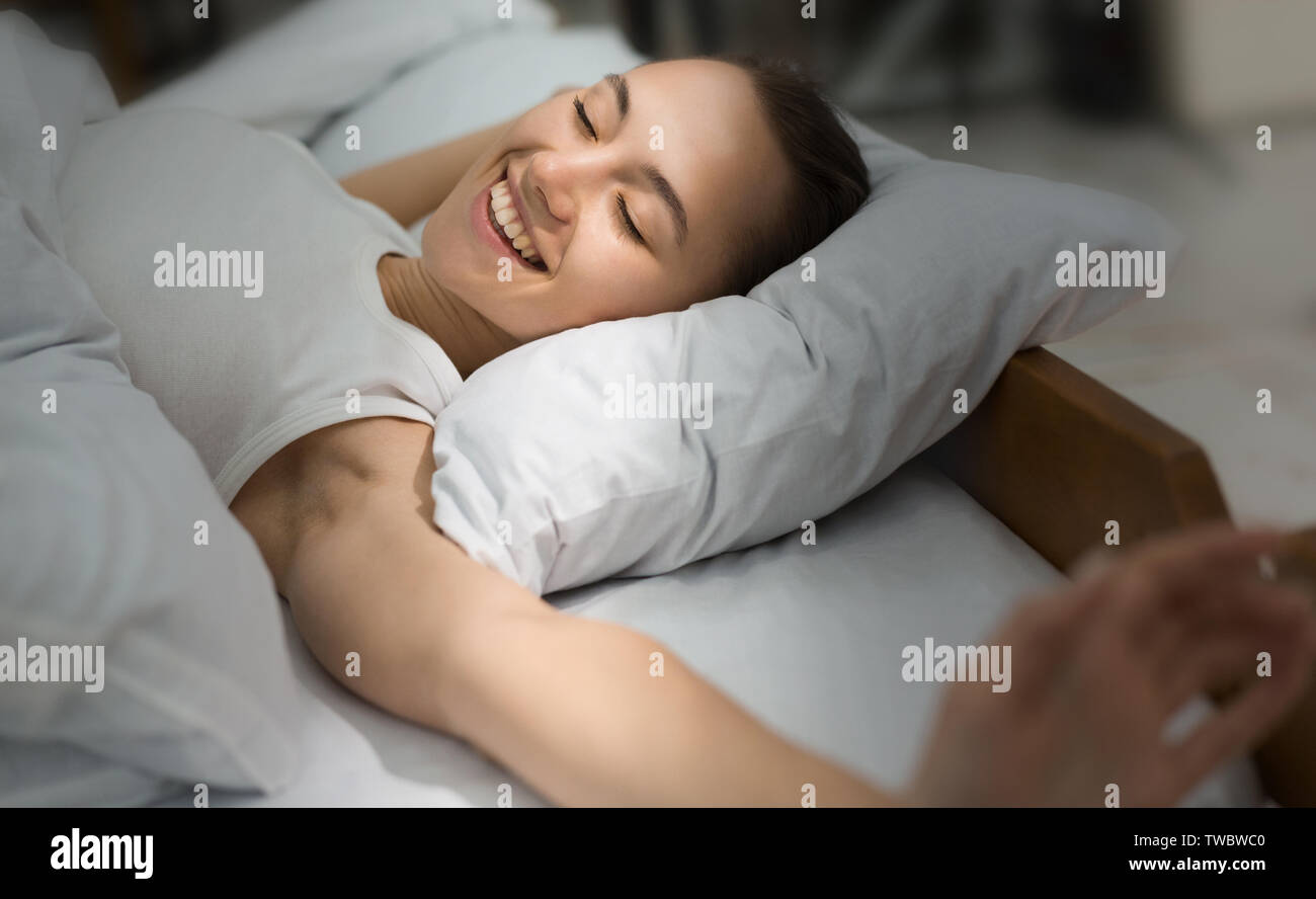 Happy Woman Waking Up And Stretching With Sunbeam On Face, Fully Rested ...