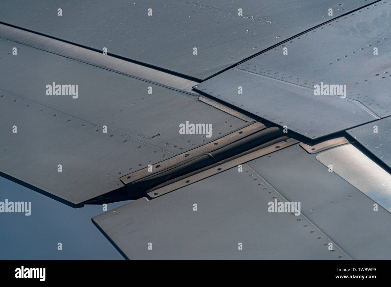 Airplane flap detail while taking off close up Stock Photo - Alamy