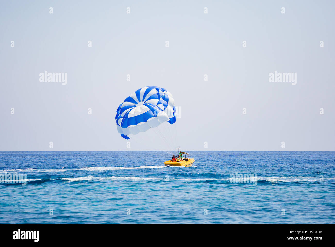 Parasailing water amusement - flying on a parachute behind a boat on a ...