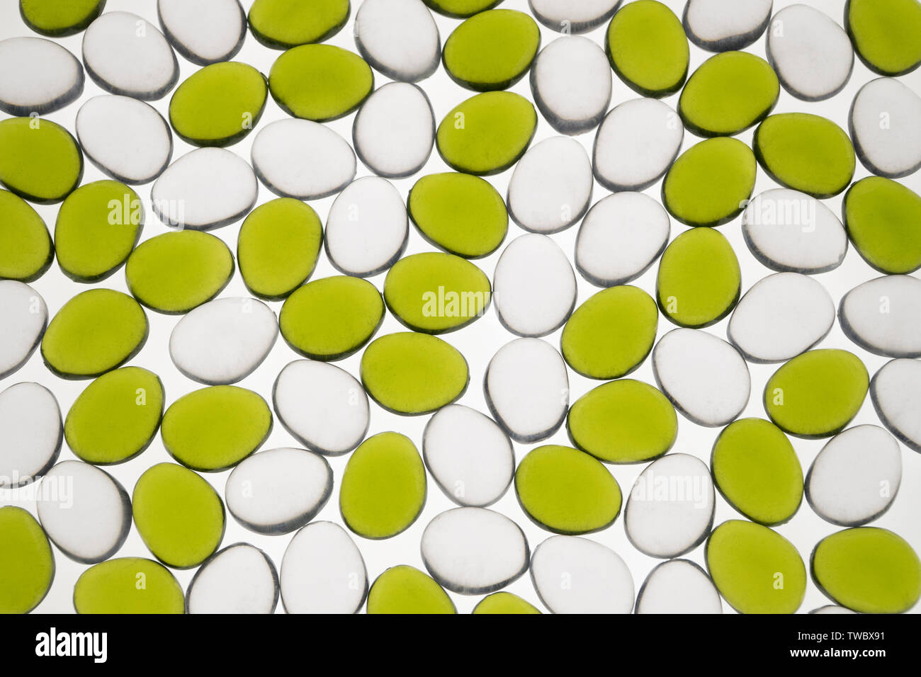 artificial round stones of green and white color, top view. imitation ...