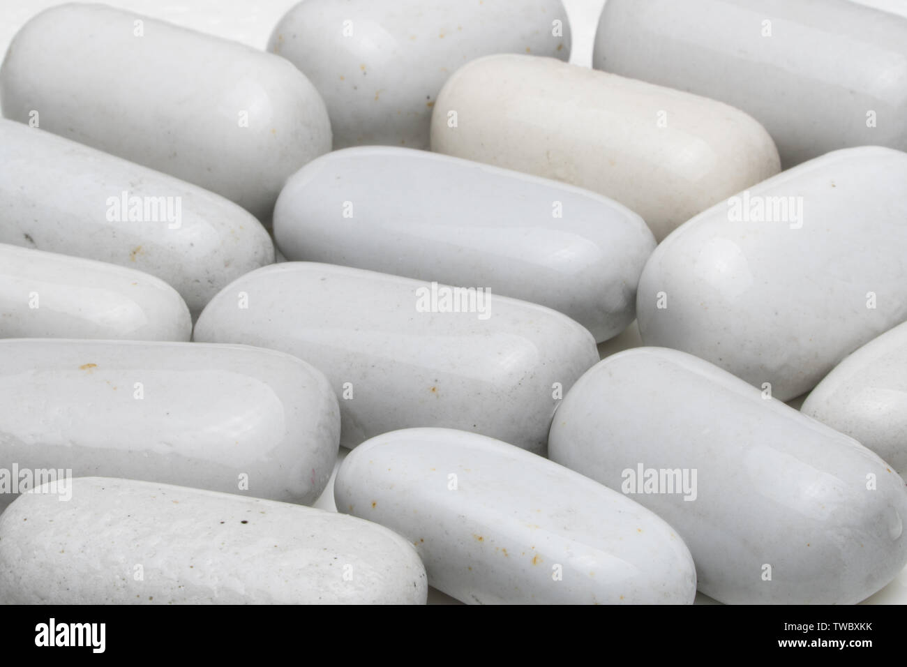 background of wet white smooth stones elongated shape Stock Photo - Alamy