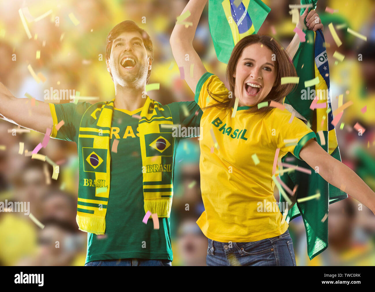 Brazilian couple Celebrating on a stadium on a soccer game, cheering ...