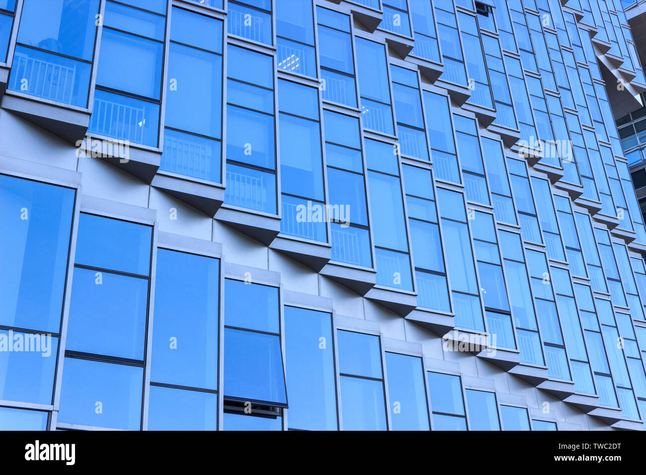 Modern architecture blue glass curtain wall Stock Photo - Alamy