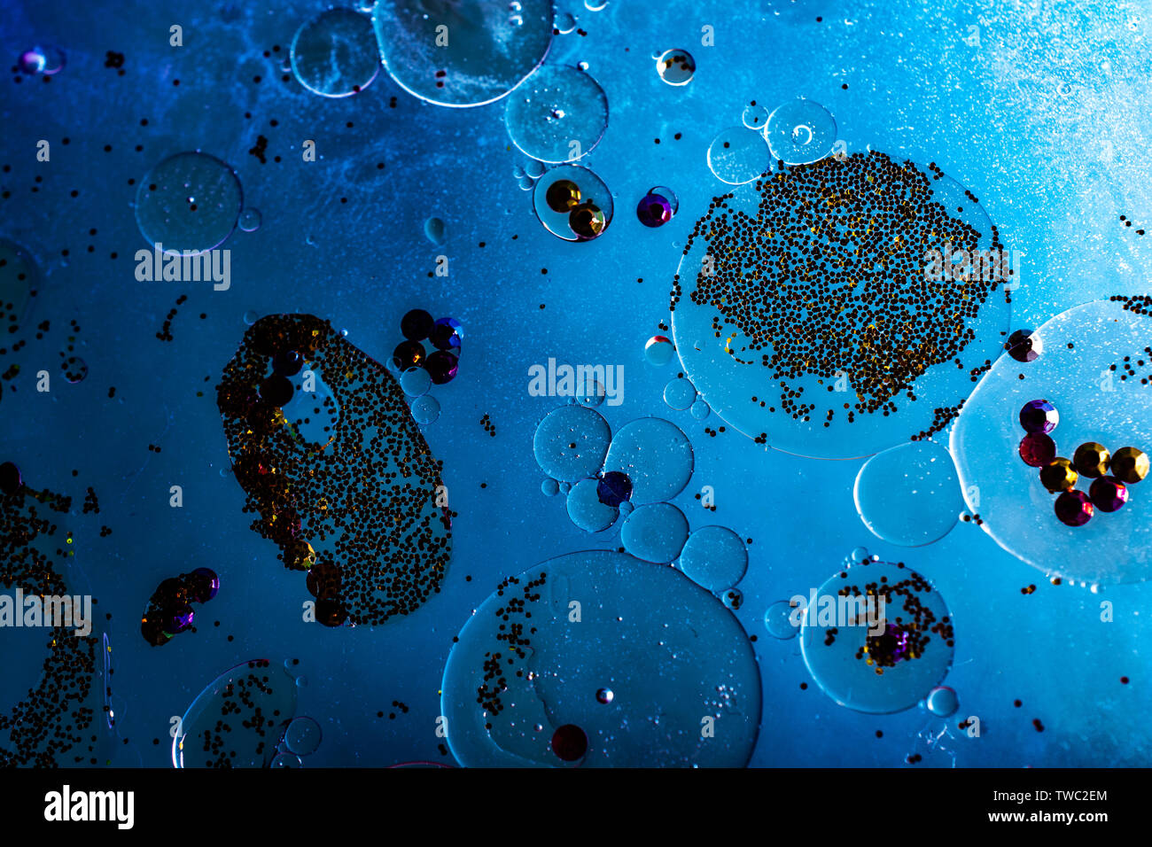 Oil bubbles inside water base form patterns Stock Photo - Alamy