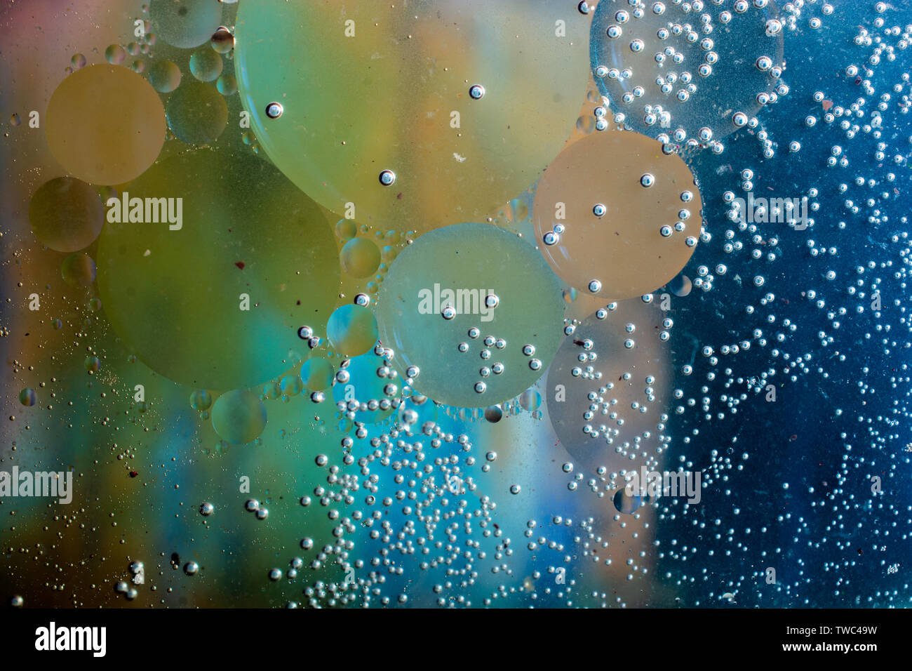 Oil bubbles inside water base form patterns Stock Photo - Alamy