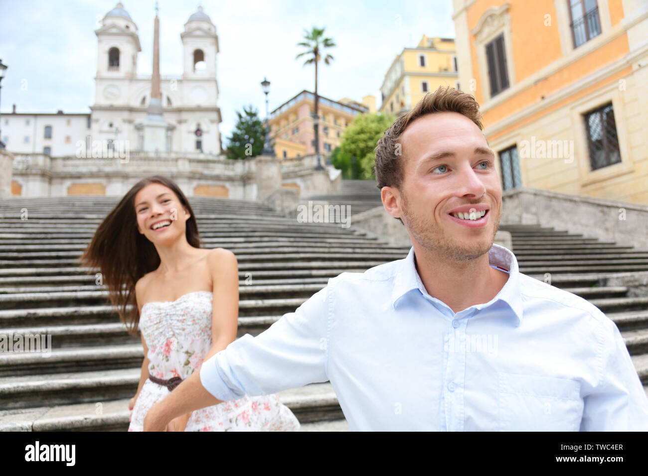 Romantic travel couple on Spanish Steps, Rome, Italy holding hands in ...