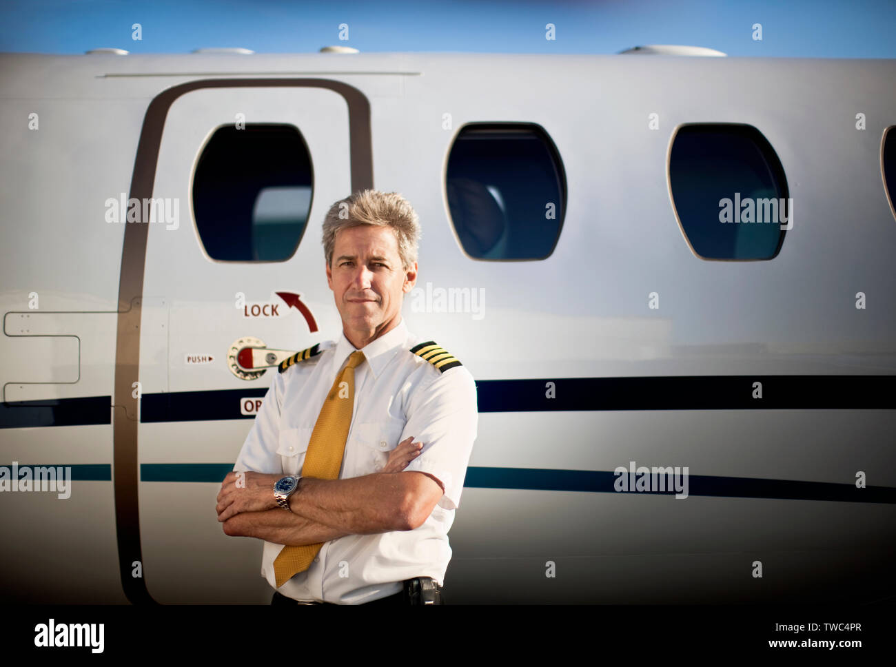A pilot in front of a plane Stock Photo - Alamy