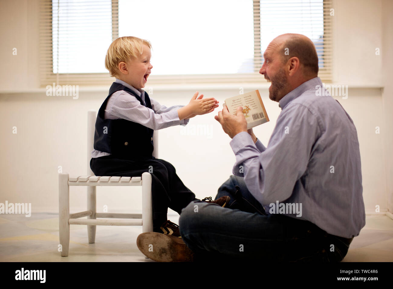 Father telling story to son Stock Photo - Alamy