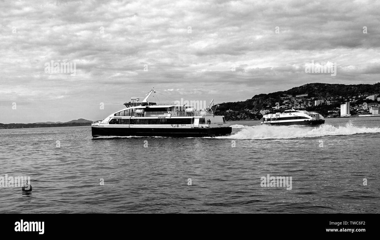 High speed passenger catamaran Ekspressen departing the port of Bergen ...