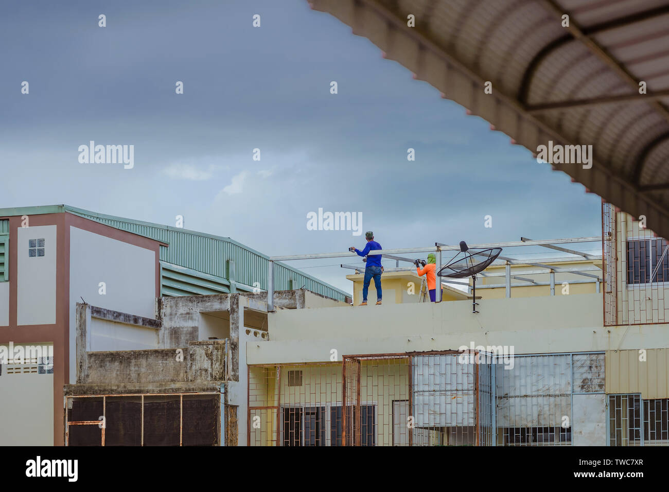 Worker welding the steel part for roof before it is going to rain Stock ...
