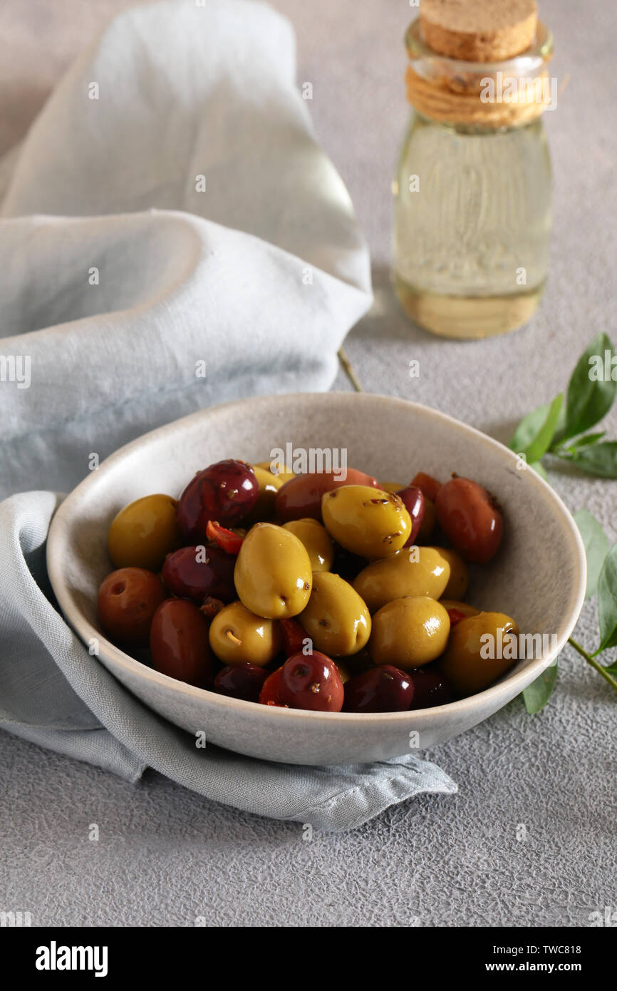 Kalamata red and green olives with herbs and herbs Stock Photo - Alamy