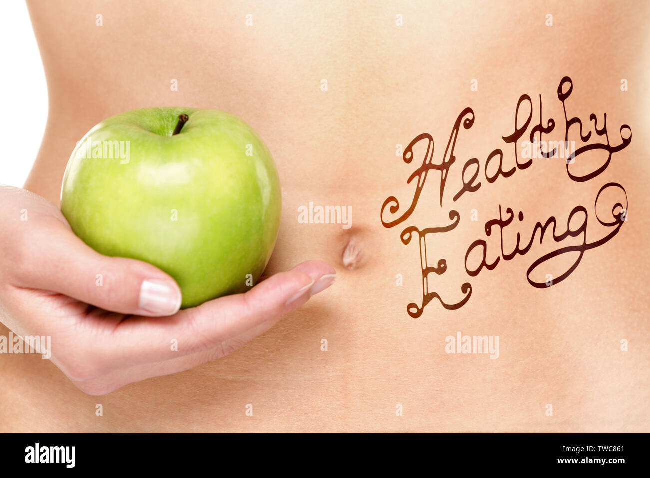 Healthy eating concept - woman stomach and apple. HEALTHY EATING text ...