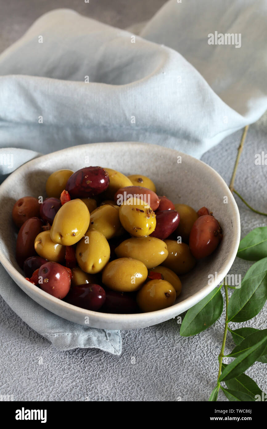 Kalamata red and green olives with herbs and herbs Stock Photo - Alamy