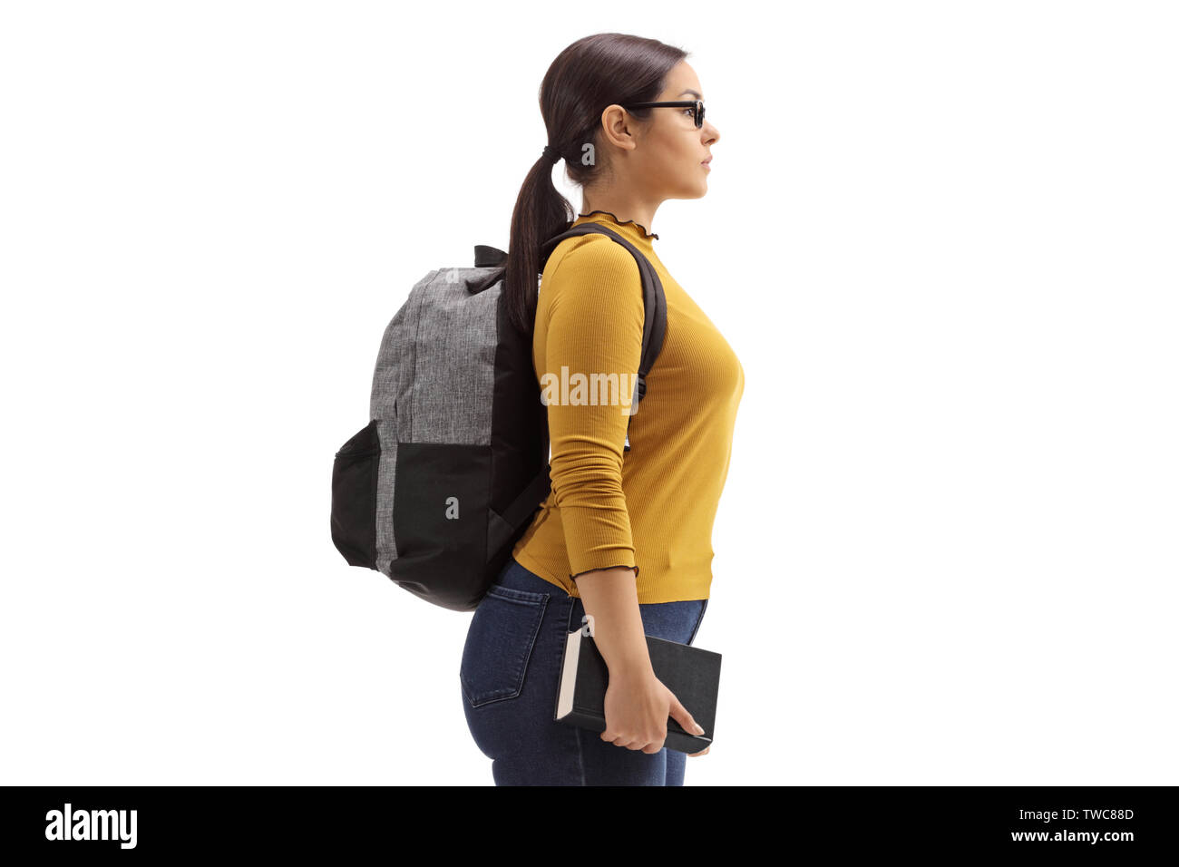 Female student with a backpack and a book waiting isolated on white ...