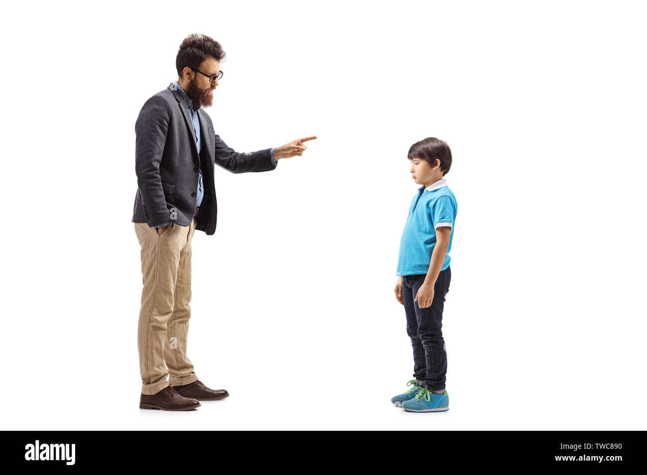 Full length profile shot of a father scolding his son isolated on white ...
