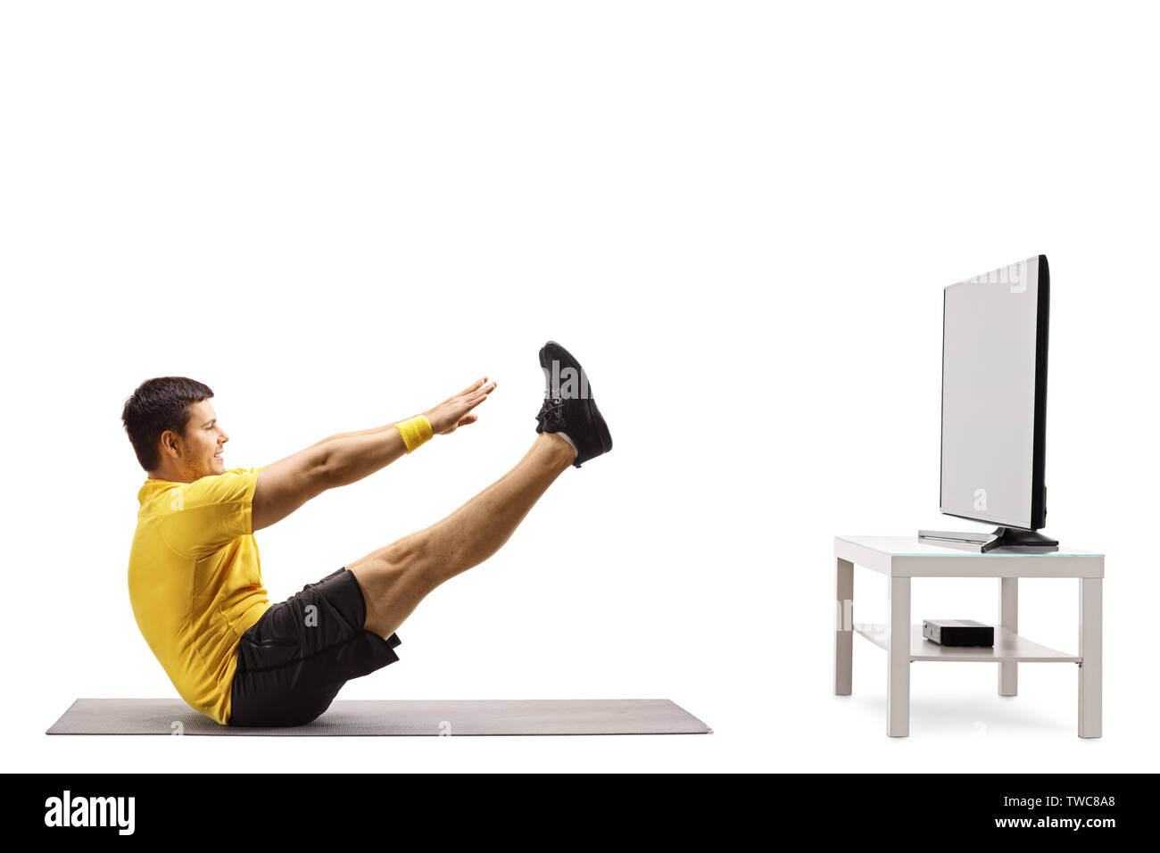Full length profile shot of a young man doing stretching exercises in ...