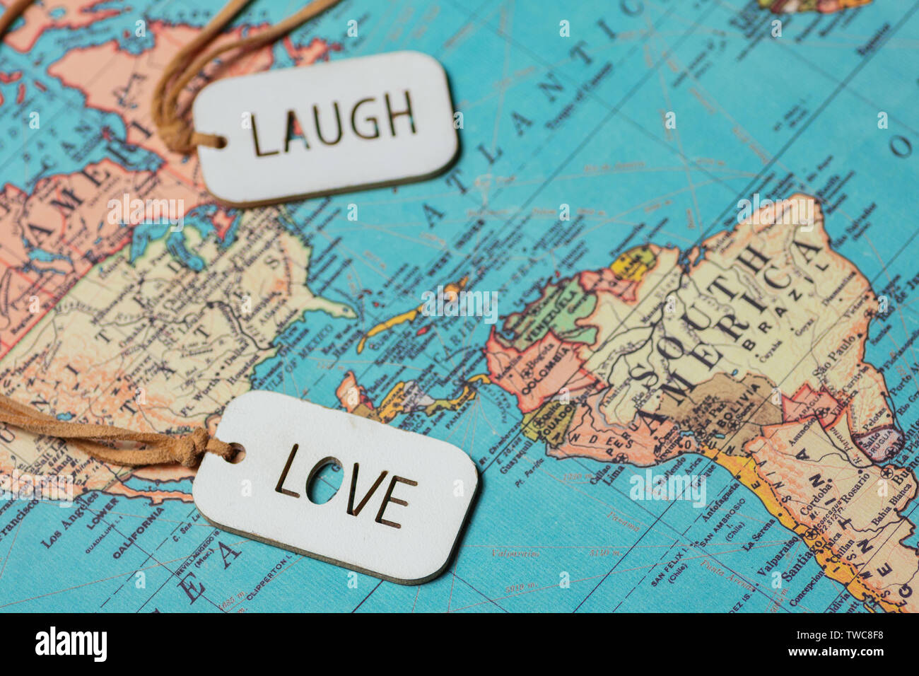 a love sign and a laugh sign on a map Stock Photo - Alamy