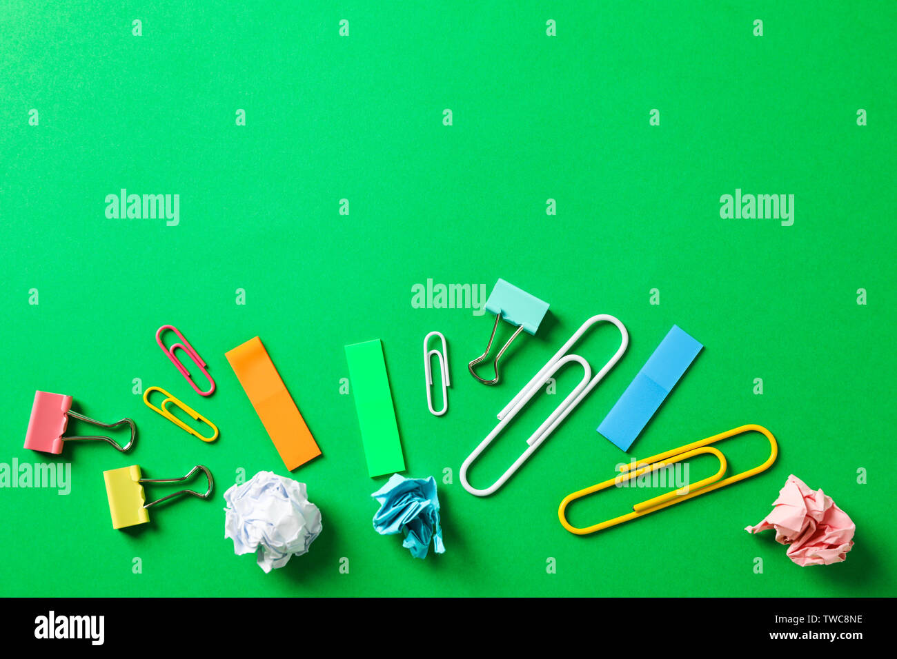 Flat lay composition with crumpled paper balls, clips and stickers on ...