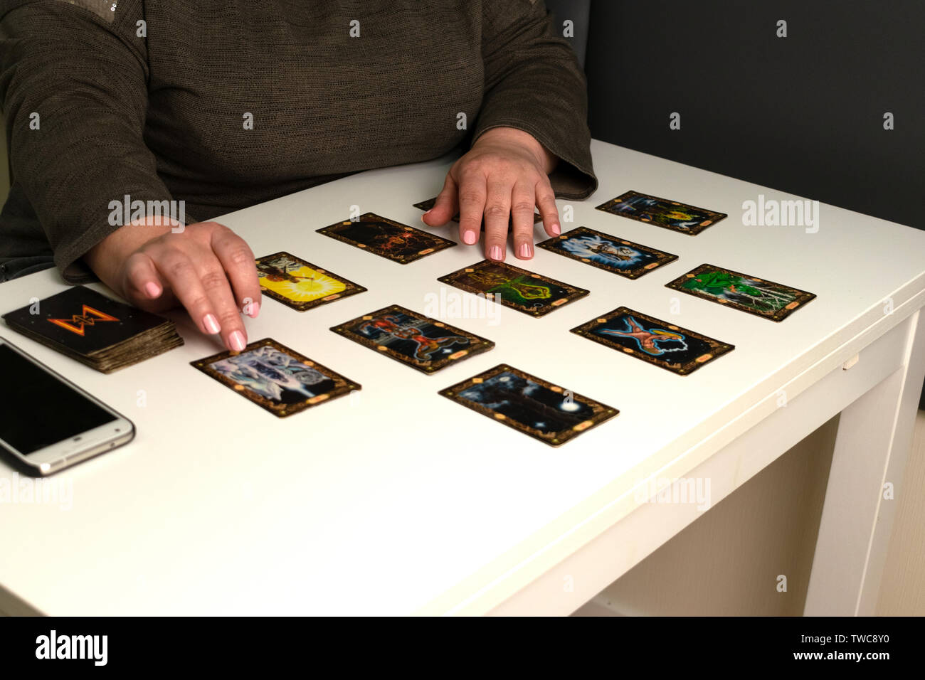 Tarot cards and fortune teller desk table. Future reading. Woman ...