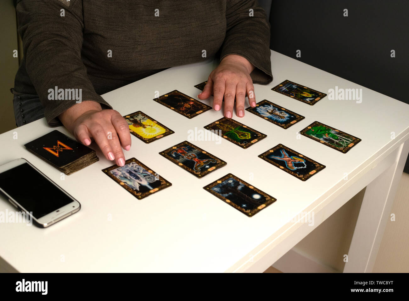 Tarot cards and fortune teller desk table. Future reading. Woman ...