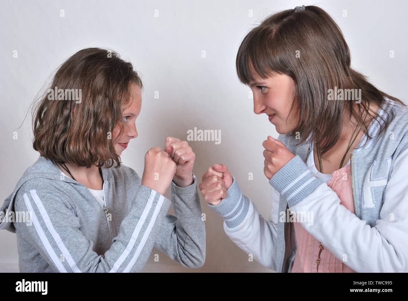 Sisters squabbling gently Stock Photo - Alamy
