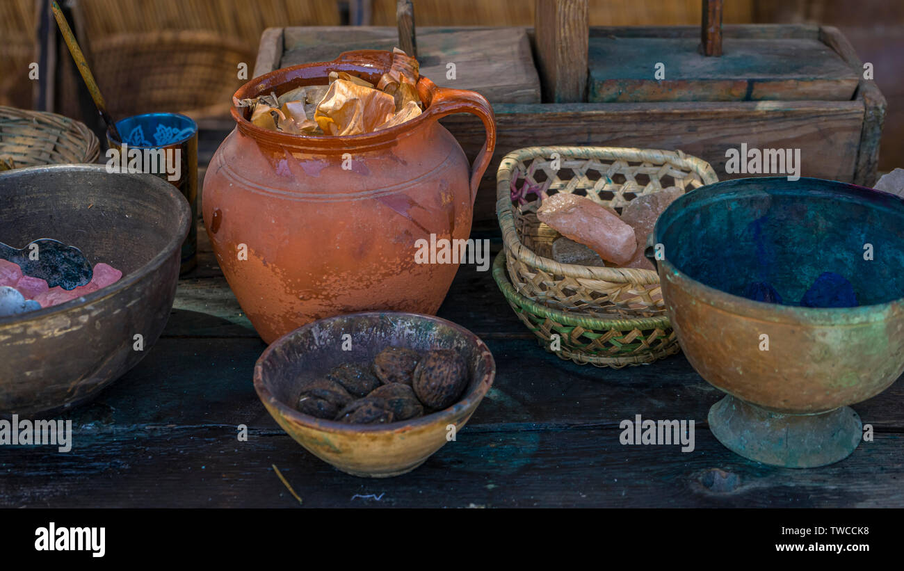 handmade dyeing of fabrics and wool in a cauldron with colored dyes in ...