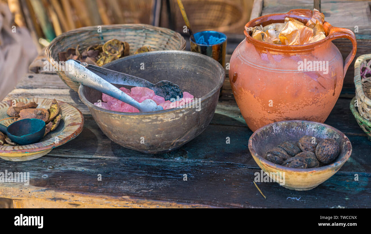 Utensils, handmade dyeing of fabrics and wool in a cauldron with ...