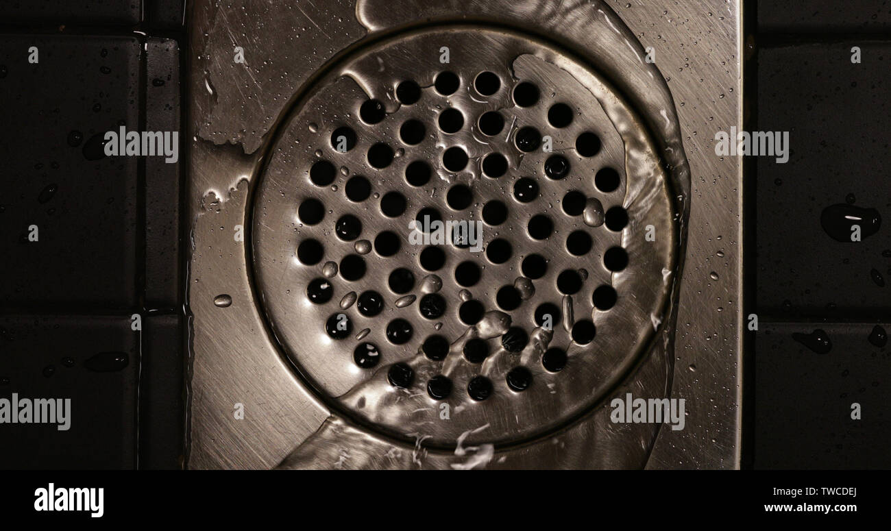 drain hole in the bathroom close-up Stock Photo - Alamy